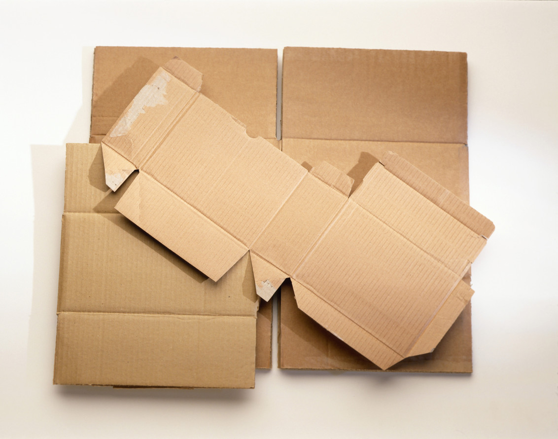 Pile of flattened plain corrugated cardboard boxes - WRAP Resource Library